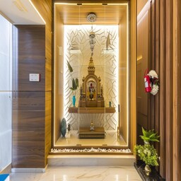 Modern Walnut Bronze Pooja Unit Design With Designer Backdrop