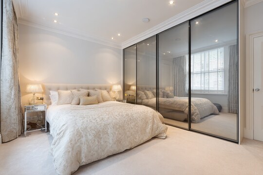 Modern 4-Door Wardrobe Design with Sliding Glass Shutters