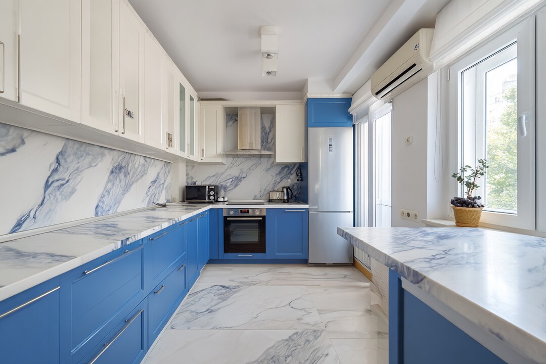 Modern L-Shaped Kitchen Design in Blue and White with Marble Countertop
