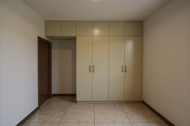 Modern Full Height Wardrobe Design with Overhead Storage